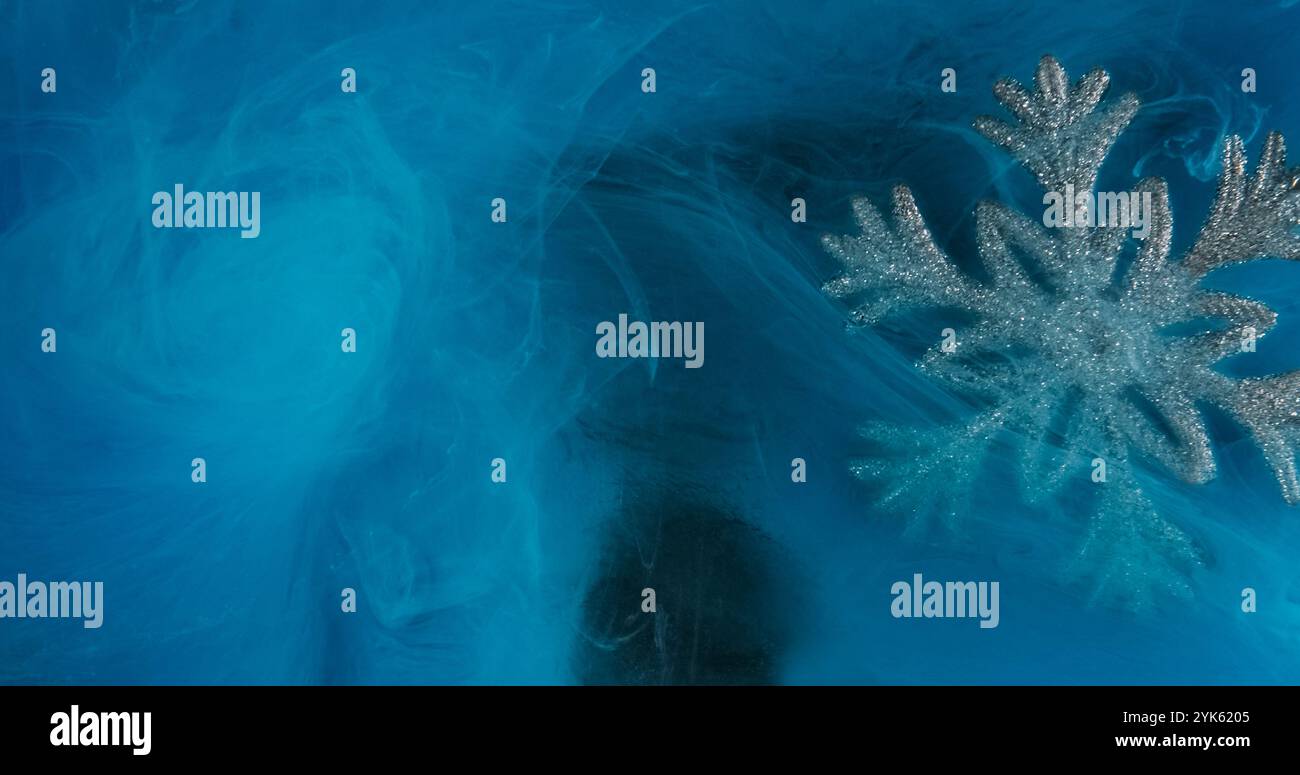 Snowflake ornament. Xmas background. Blue color paint water smoke cloud ...