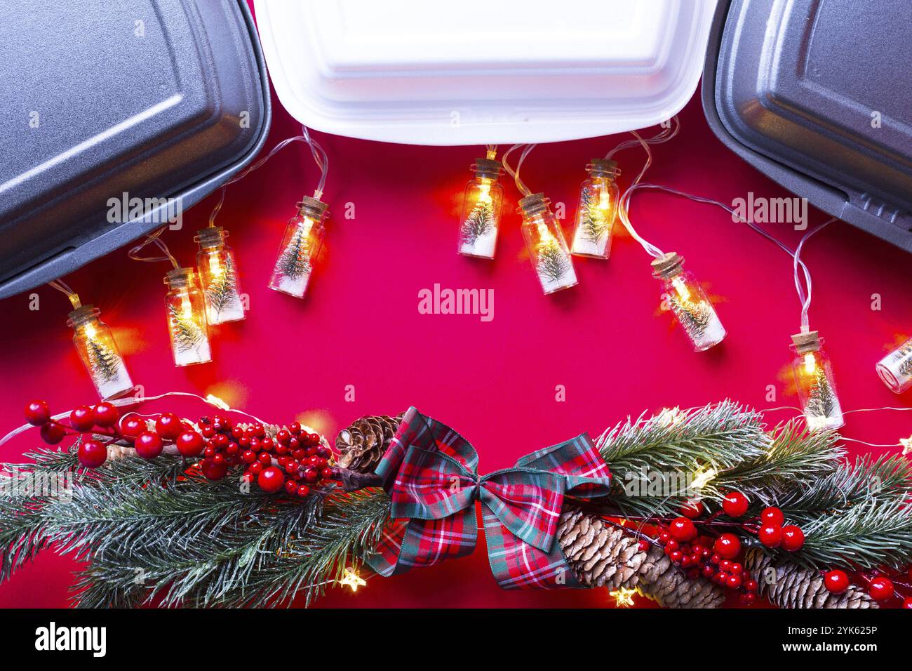 Christmas decor of food delivery service containers. New year's eve ...