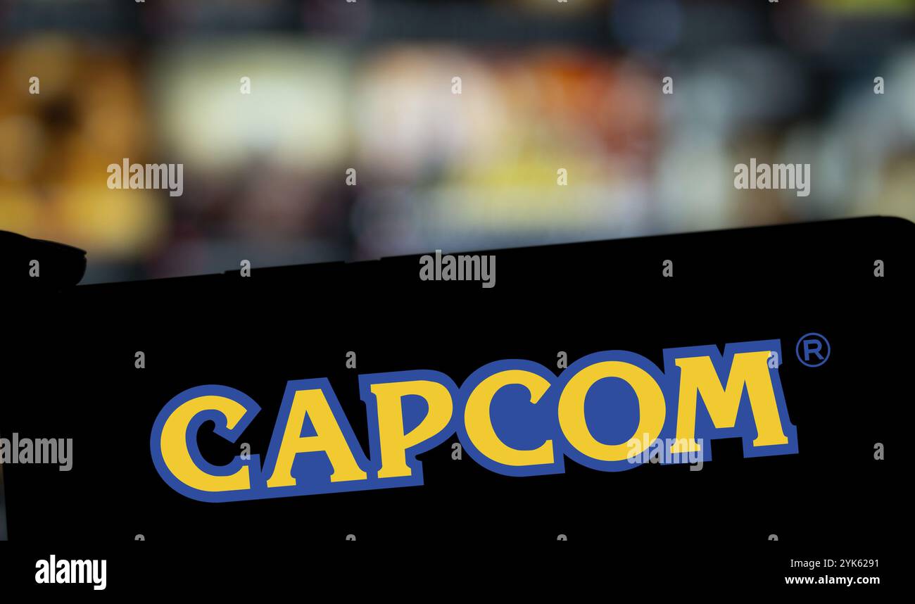 Capcom logo is displayed on smartphone.Capcom is a Japanese video game ...