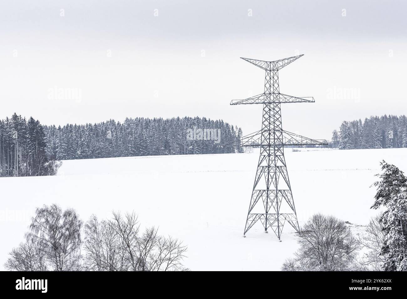 Construction of high voltage pylons in winter. Assembled power ...