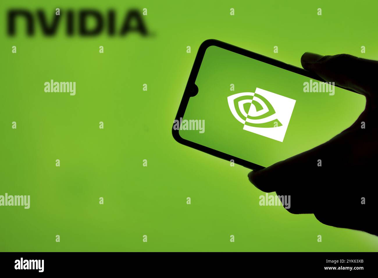Nvidia logo on smartphone screen with AI in the background. Nvidia ...