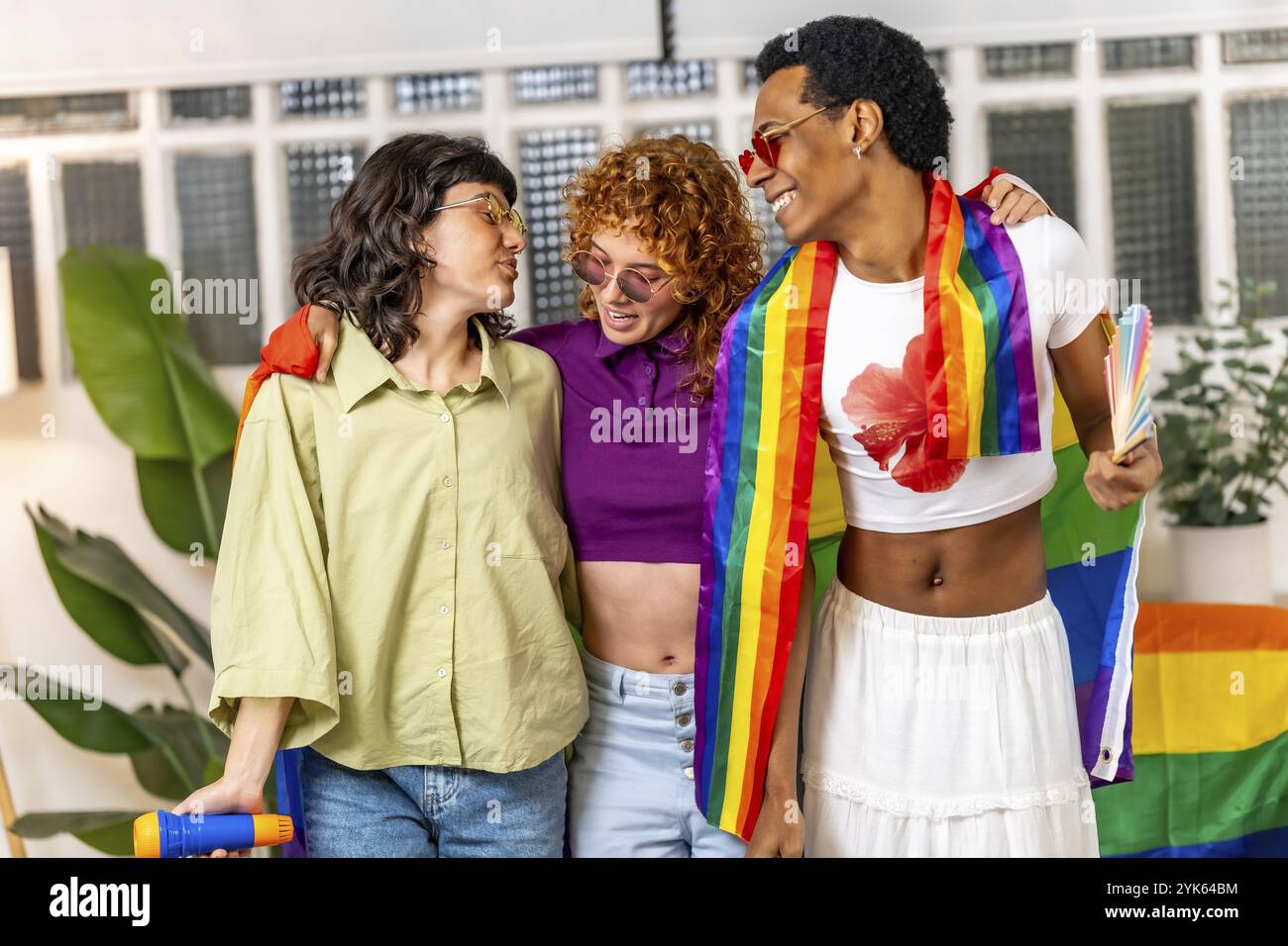 Multi-ethnic lgbt friends singing karaoke and partying with rainbow ...