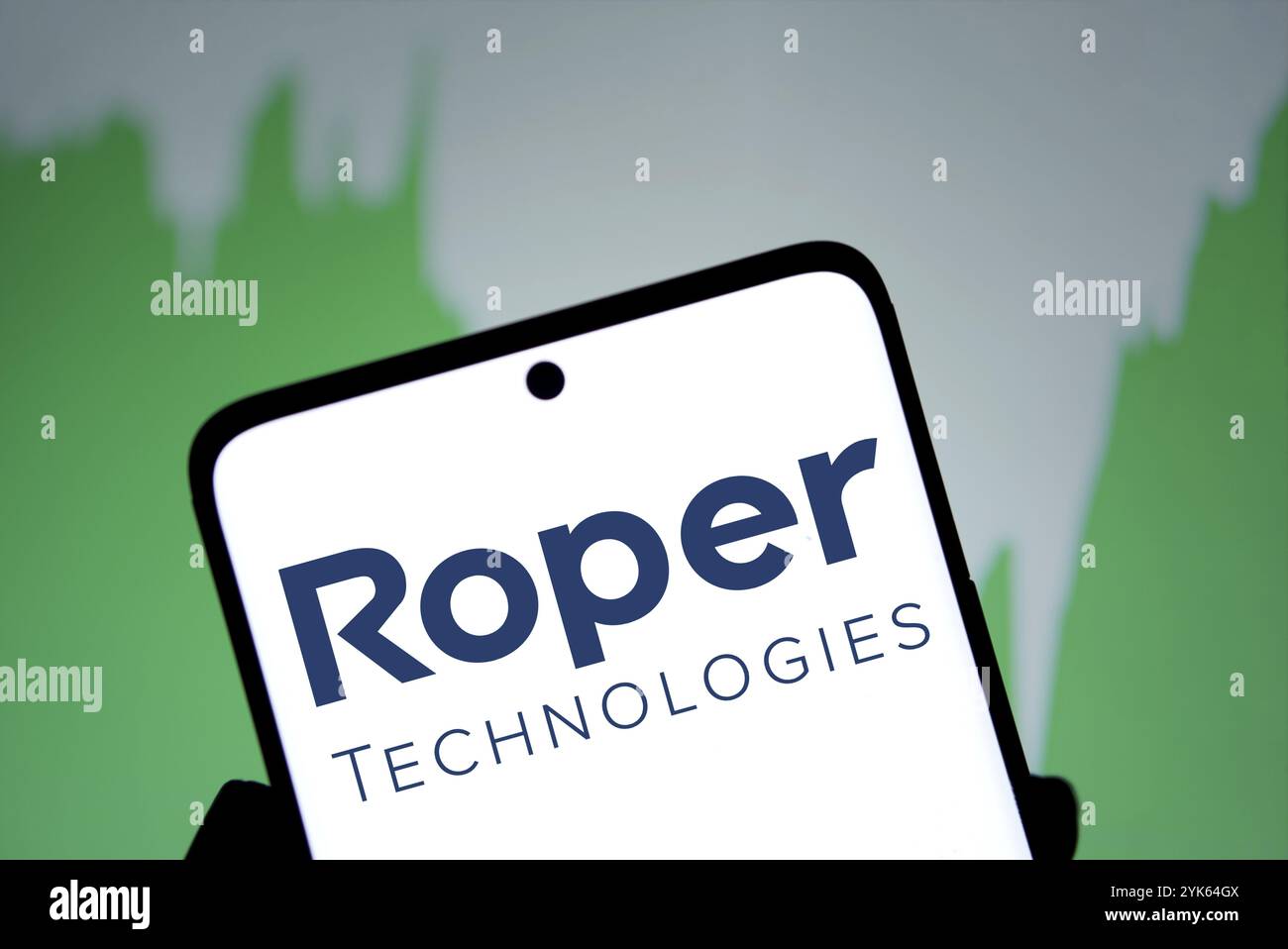 Roper Technologies logo is displayed on smartphone. Roper Technologies ...