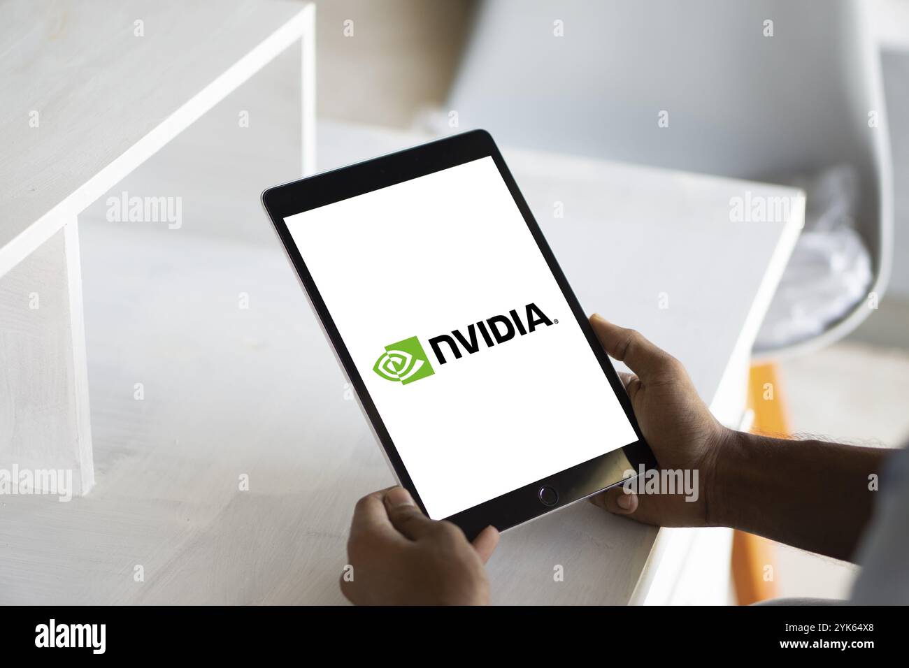 Nvidia logo on smartphone screen with AI in the background. Nvidia ...