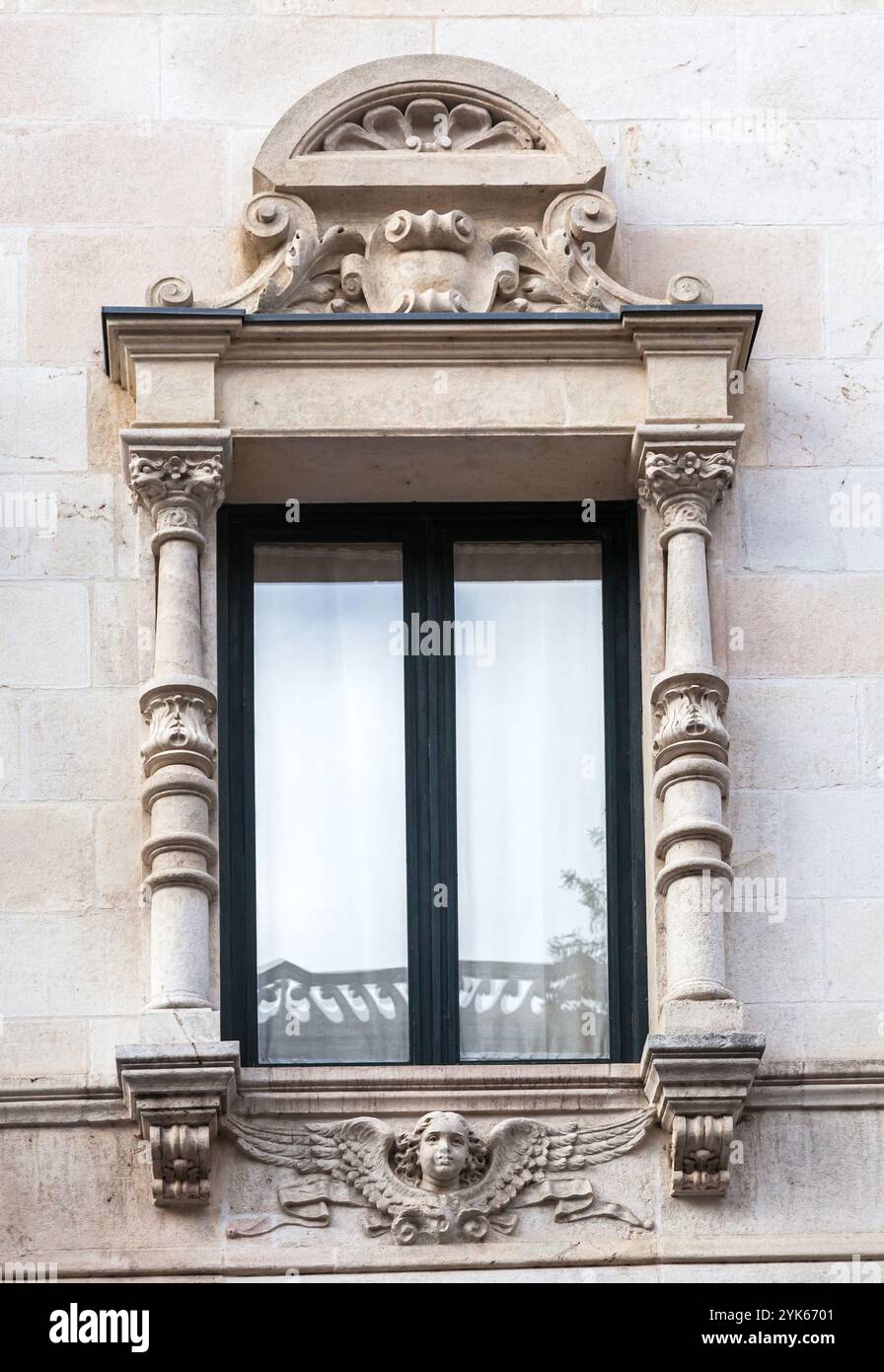 An ornate stone window adorned with intricate carvings and classic ...