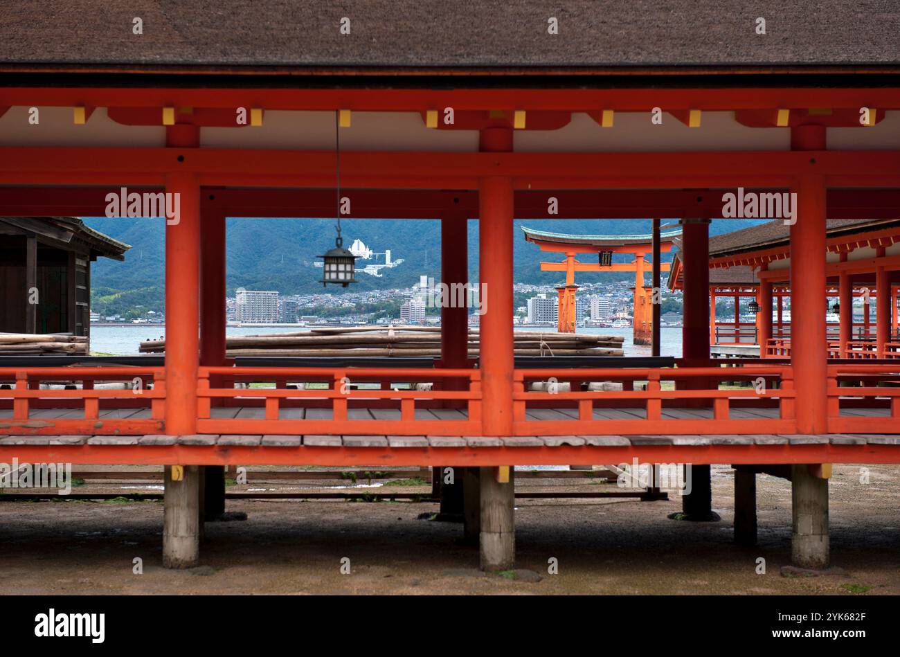 Covered walkway at Itsukushima Jinja Shinto shrine with famous floating ...