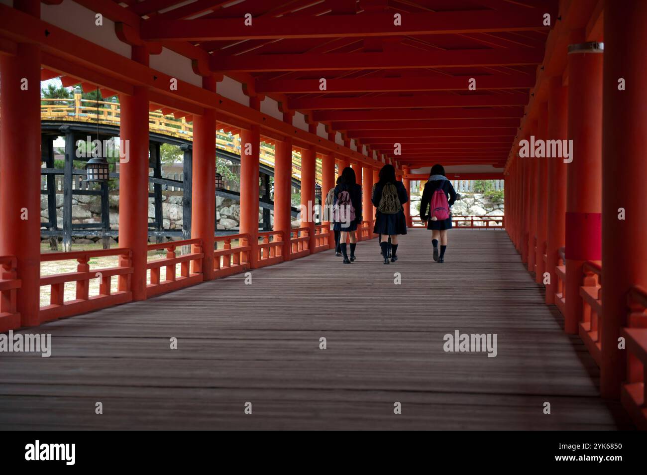 View down a long covered deck hallway at the famous Itskushima Jinja ...