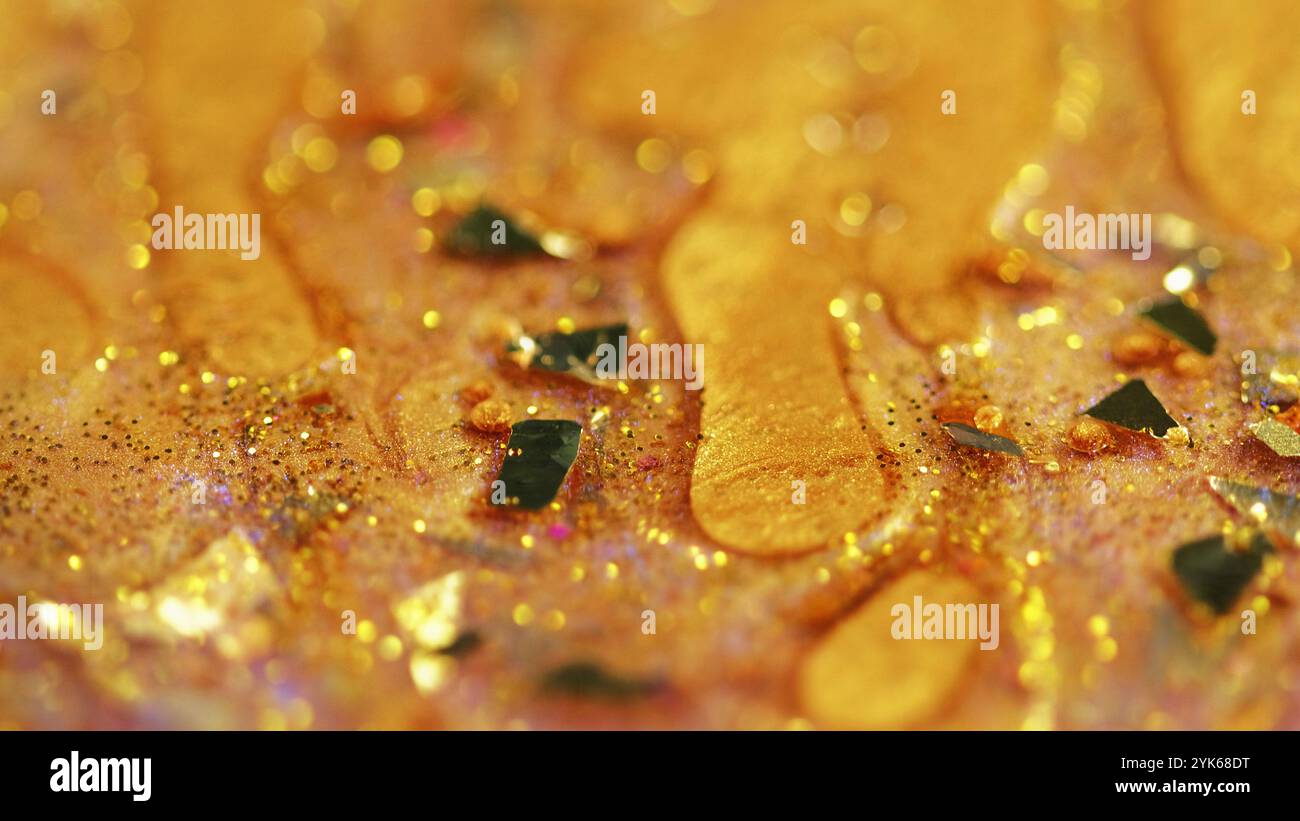 Sparkling oil drop. Glitter paint spill. Blur golden color shiny ...