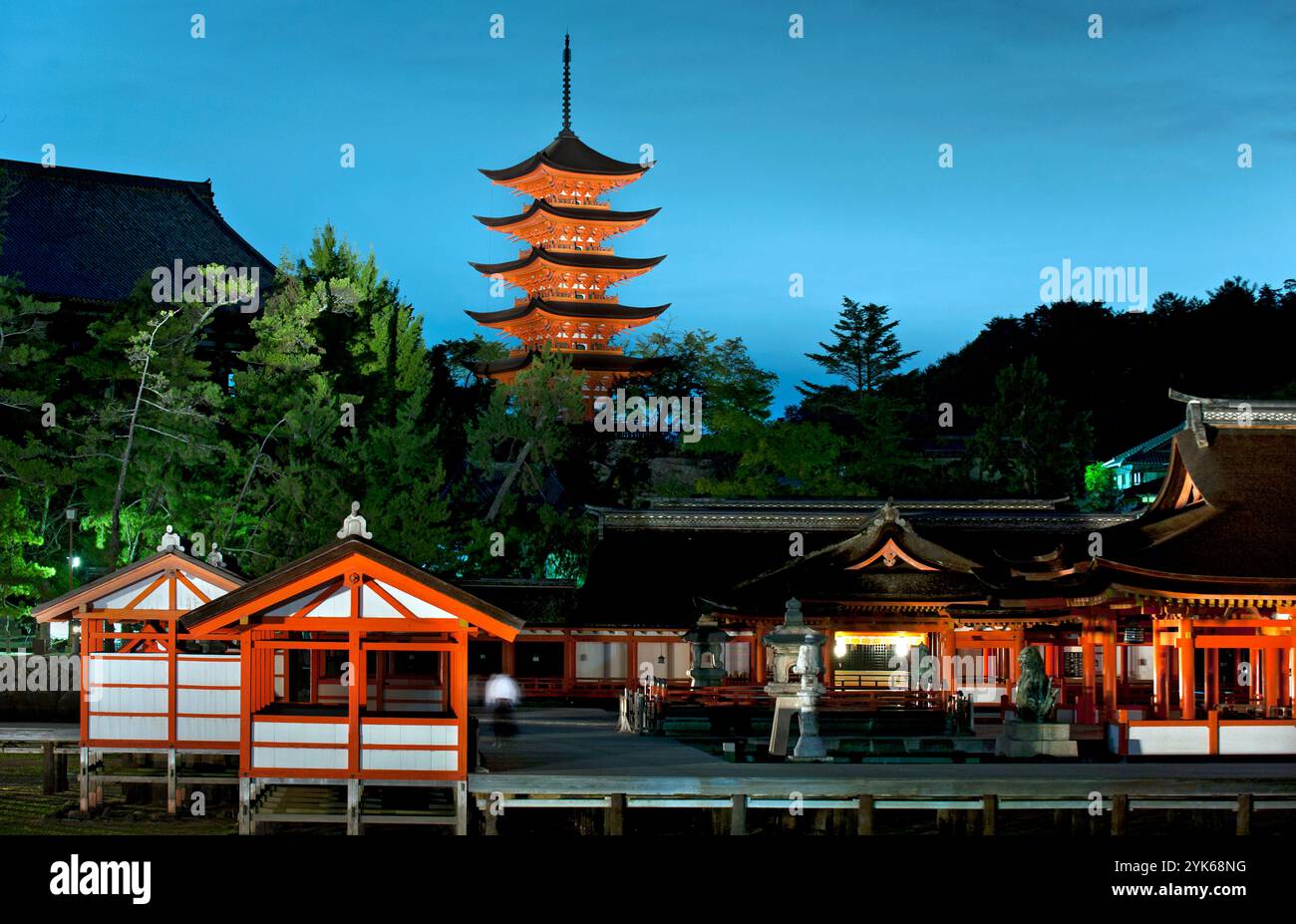 Evening view of Itsukushima Jinja Shinto shrine and 5-story pagoda on ...