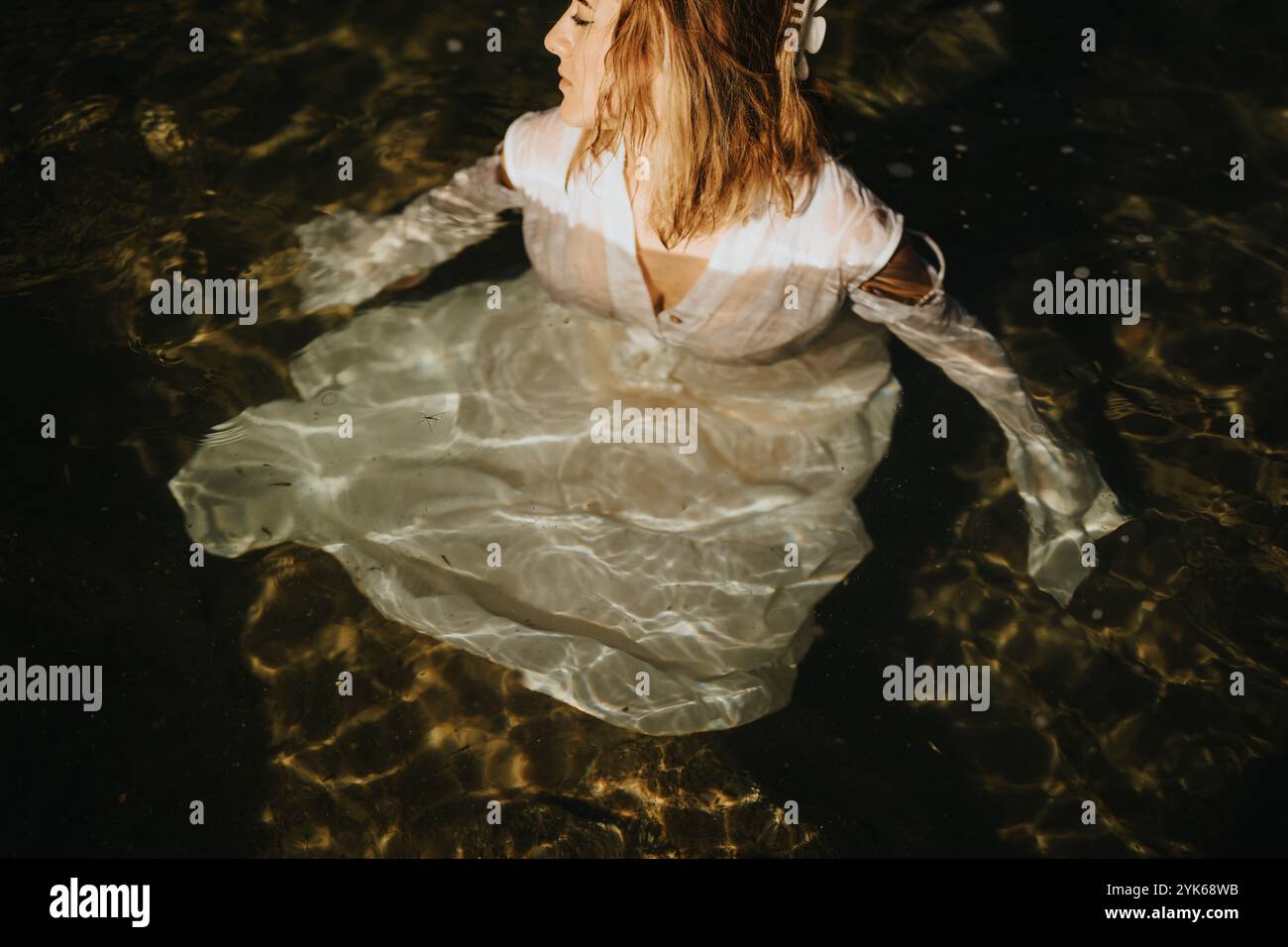 Woman wearing dress underwater in hi-res stock photography and images ...