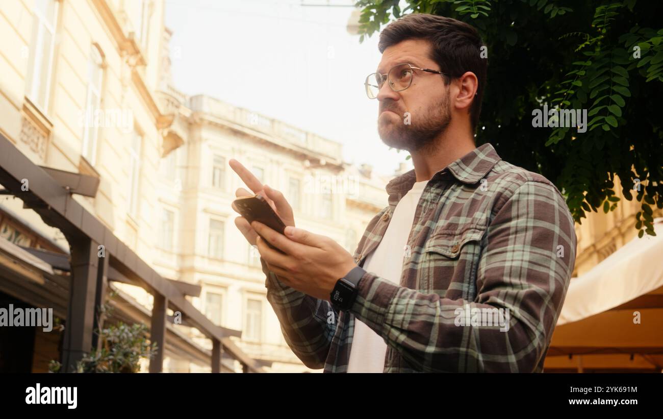 Confused man tourist looking address hi-res stock photography and ...
