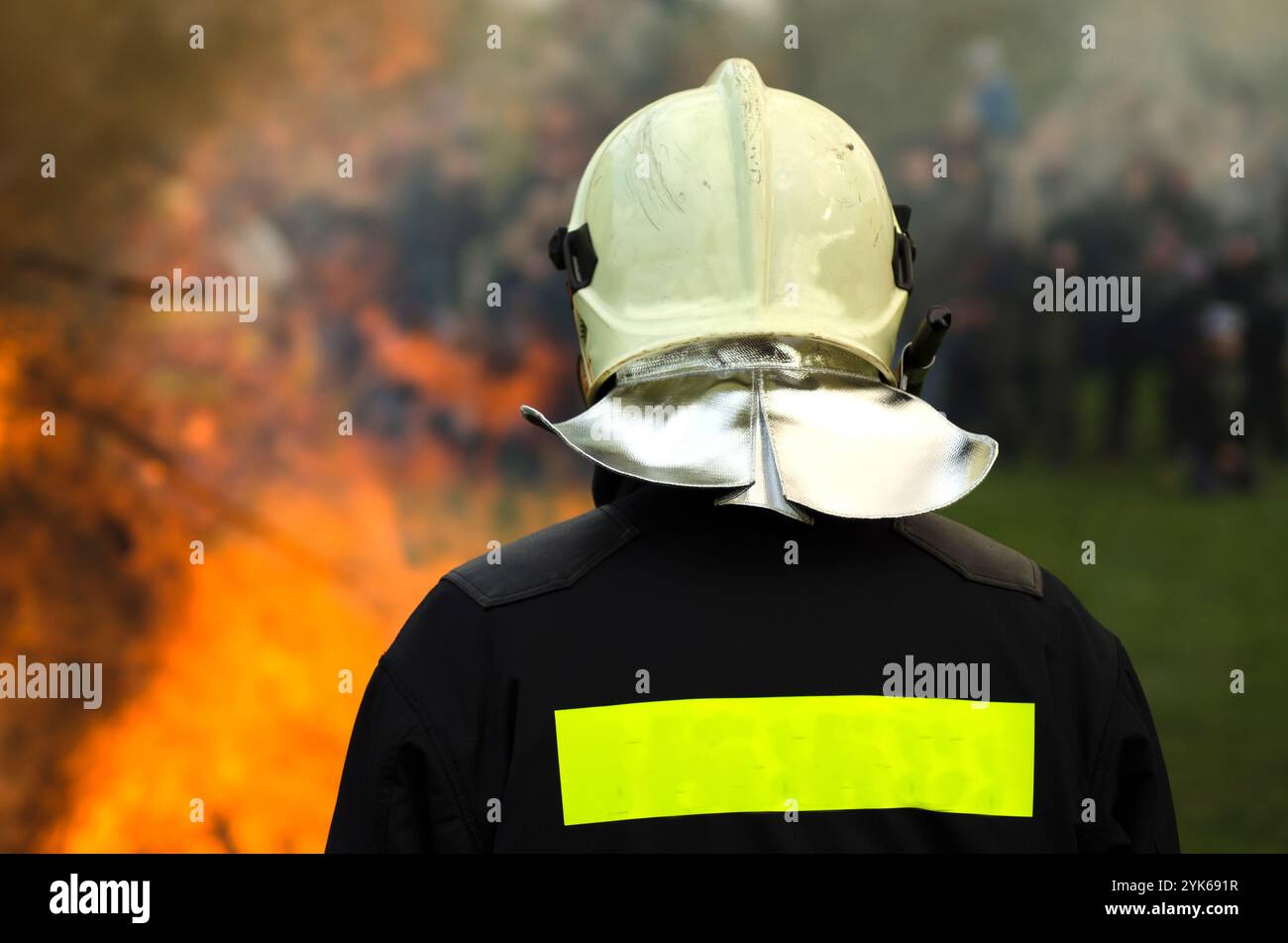 Fireman on the back of forest fire, back view Stock Photo - Alamy