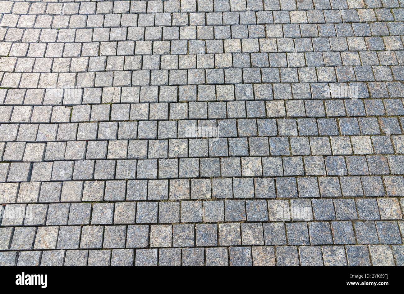 Stone pavement in the rays of the setting sun. Backround of Block ...