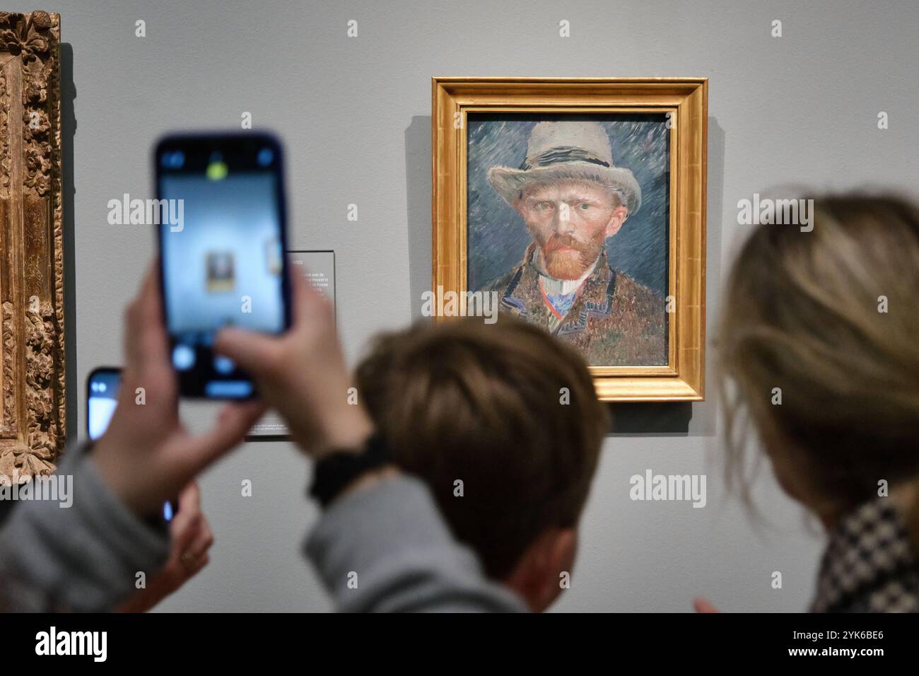 People taking photos of the self portrait painting of Vincent Van Gogh ...