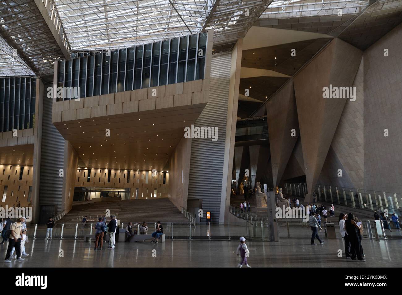 Visitors in the Grand Egyptian Museum's atrium and going up the ...