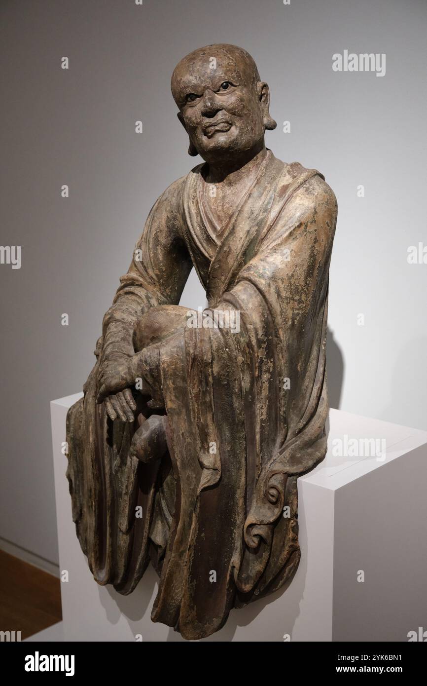 Statue of Xianglong Luohan, follower of the Buddha, a Chinese sculpture ...