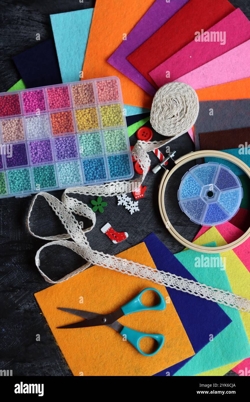 DIY project in making. Top view photo of colorful glass beads, felt ...