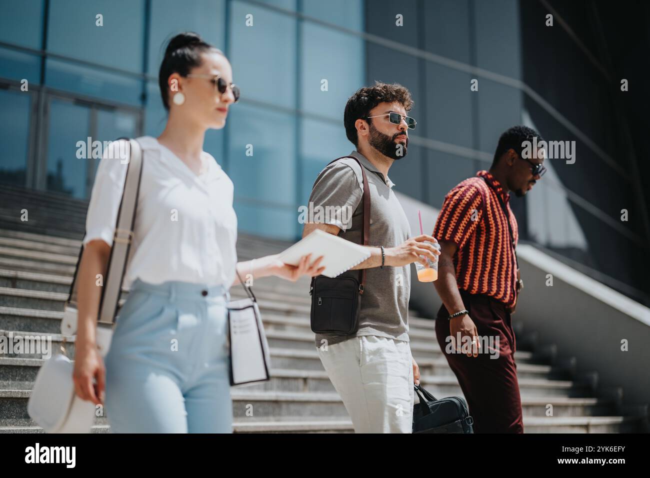 Business people walking and collaborating in an urban city environment ...