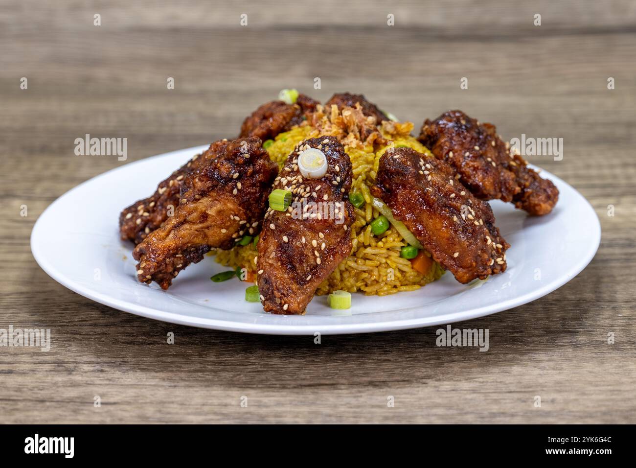 Generous scoop of Vietnamese fried rice with delicious chicken wings ...