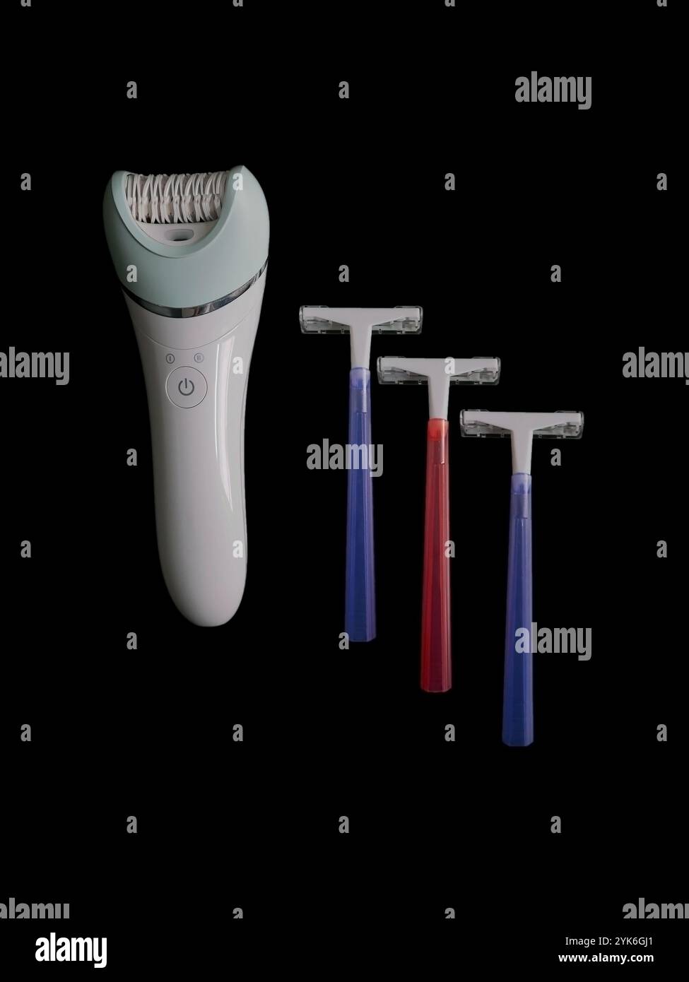 Different products for removing body hair - razor and epilator isolated ...