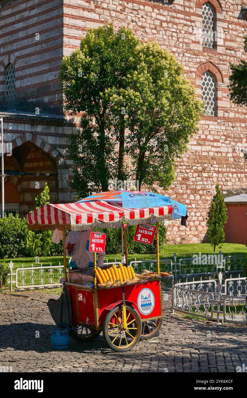 A man with a colourful trolley outside the Hagia Sophia mosque selling ...
