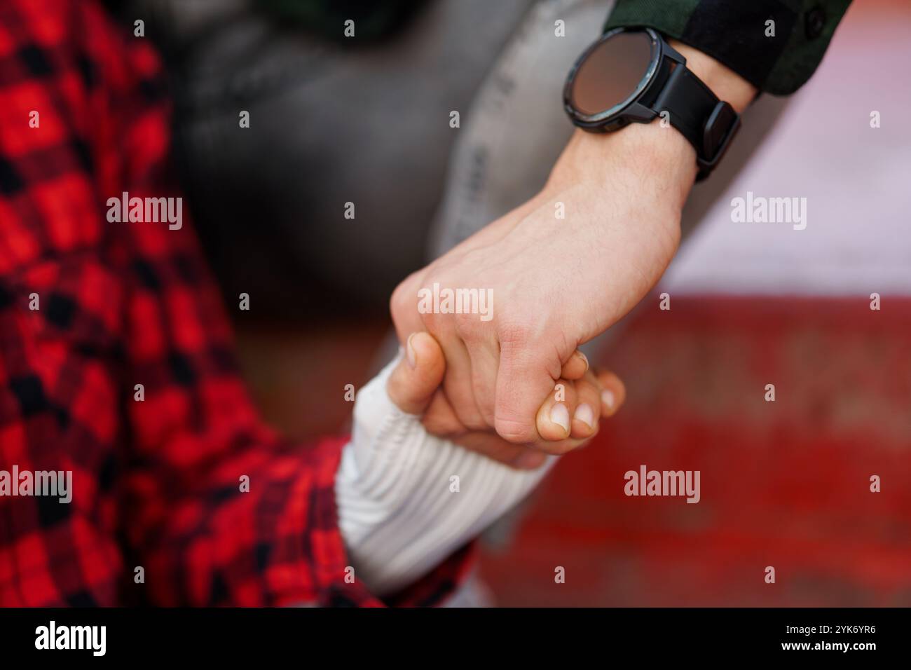 A Compassionate Moment: Two Hands Intertwined in Support and Connection ...