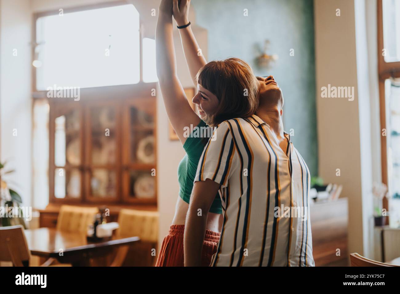 Couple joyfully dancing laughing together hi-res stock photography and ...
