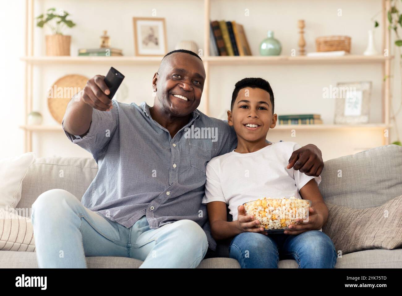 Grandfather grandson watching video hi-res stock photography and images ...