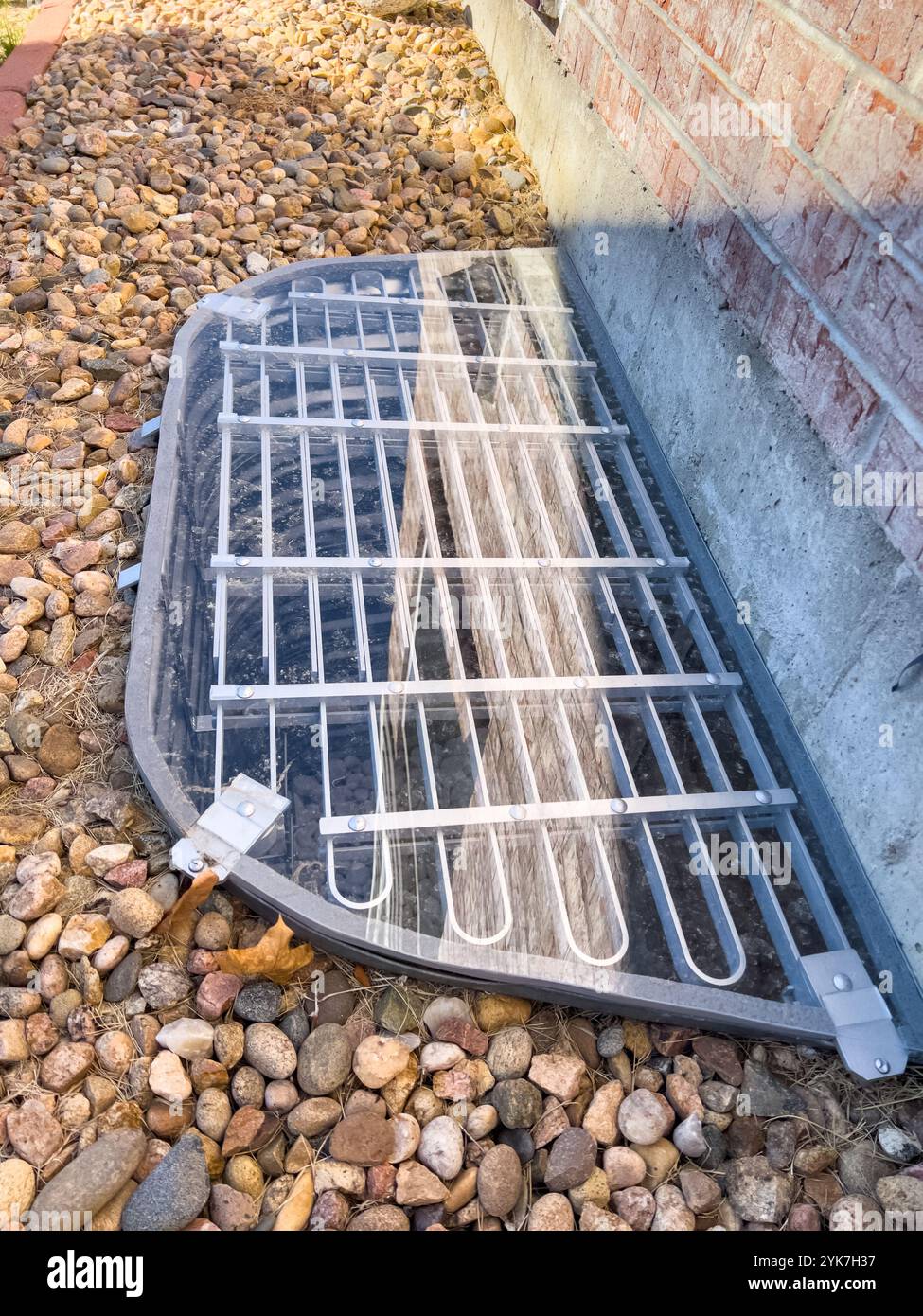 Custom Plexiglass Window Well Cover in Late Fall Stock Photo - Alamy