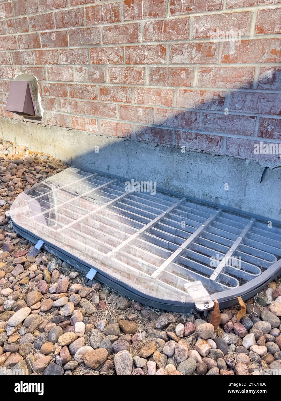 Custom Plexiglass Window Well Cover in Late Fall Stock Photo - Alamy