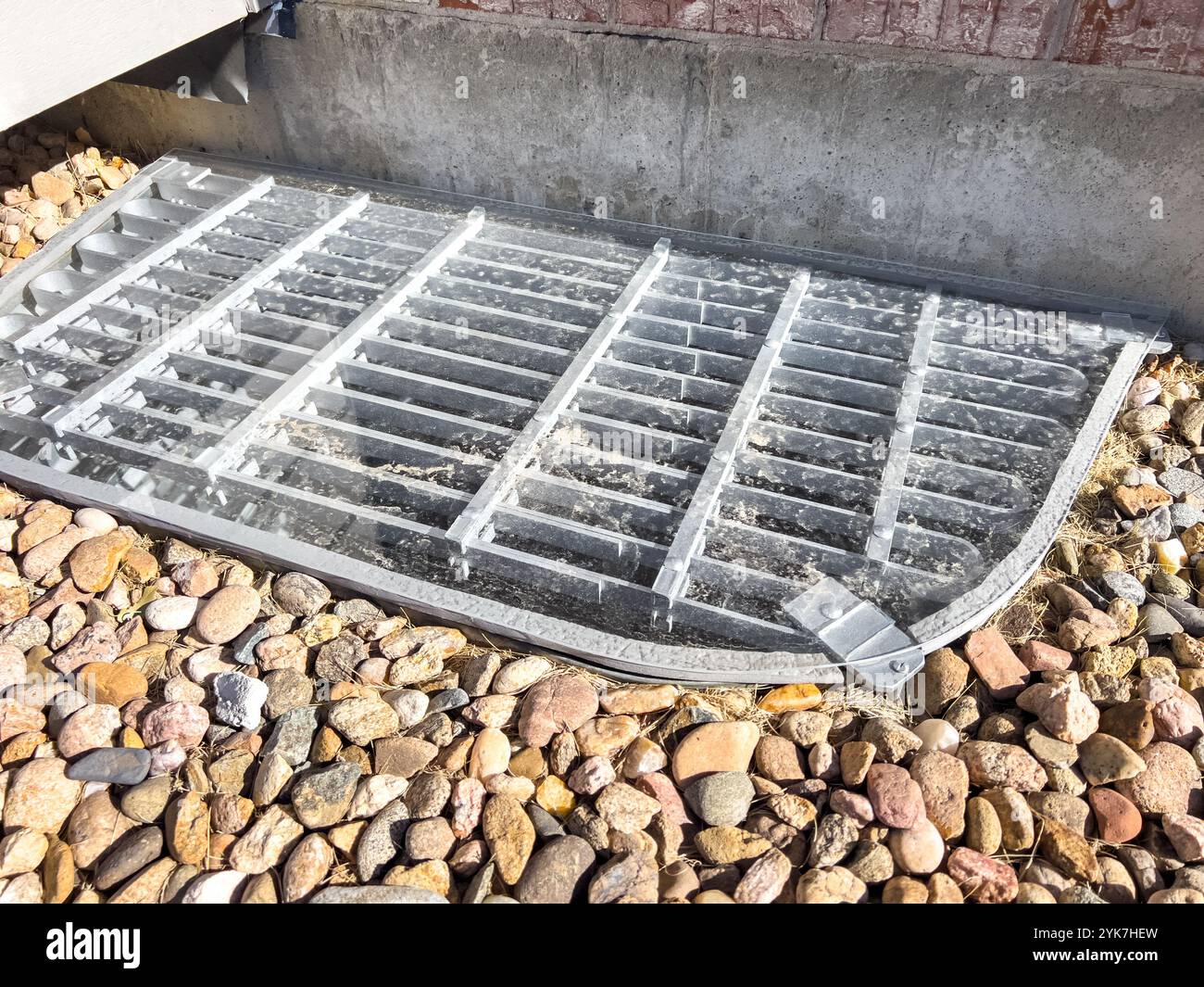 Custom Plexiglass Window Well Cover in Late Fall Stock Photo - Alamy