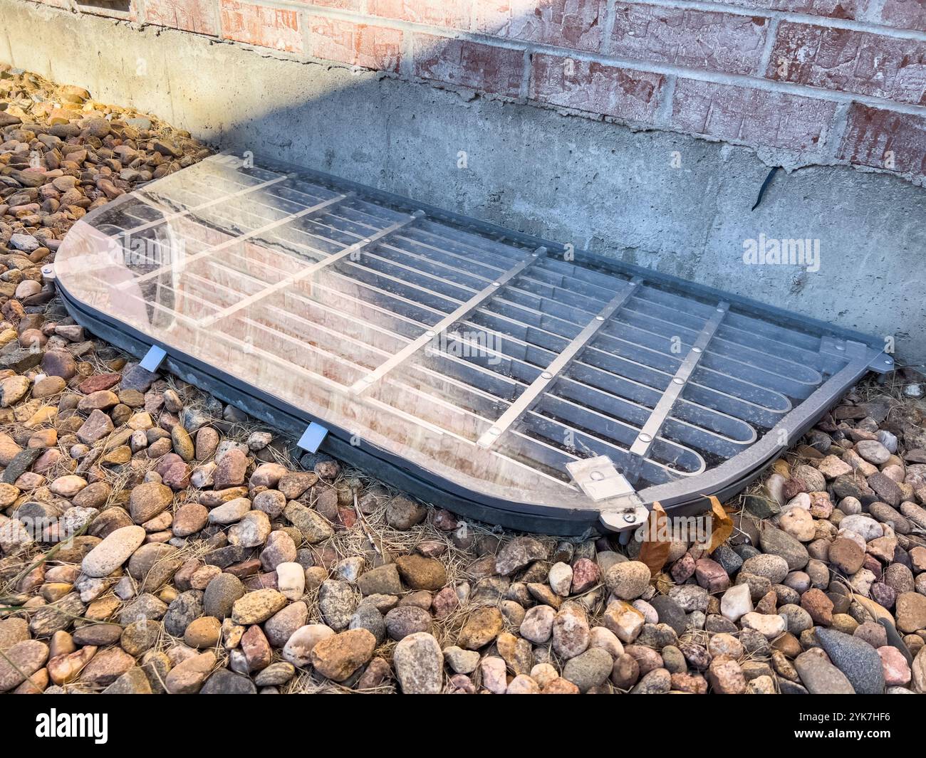 Custom Plexiglass Window Well Cover in Late Fall Stock Photo - Alamy