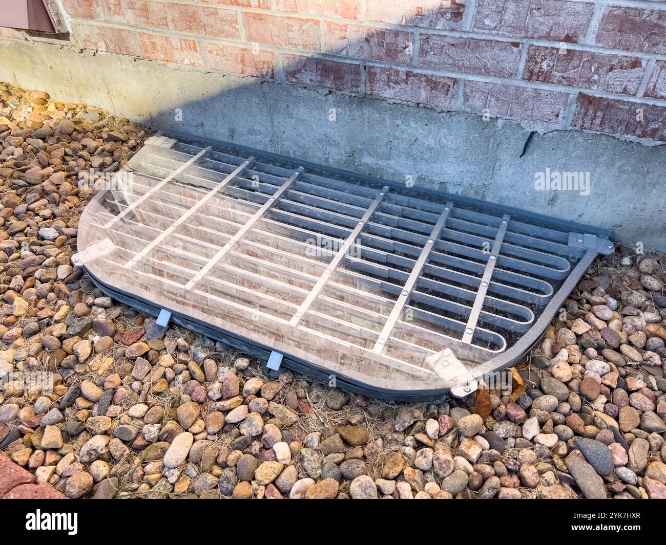 Custom Plexiglass Window Well Cover in Late Fall Stock Photo - Alamy