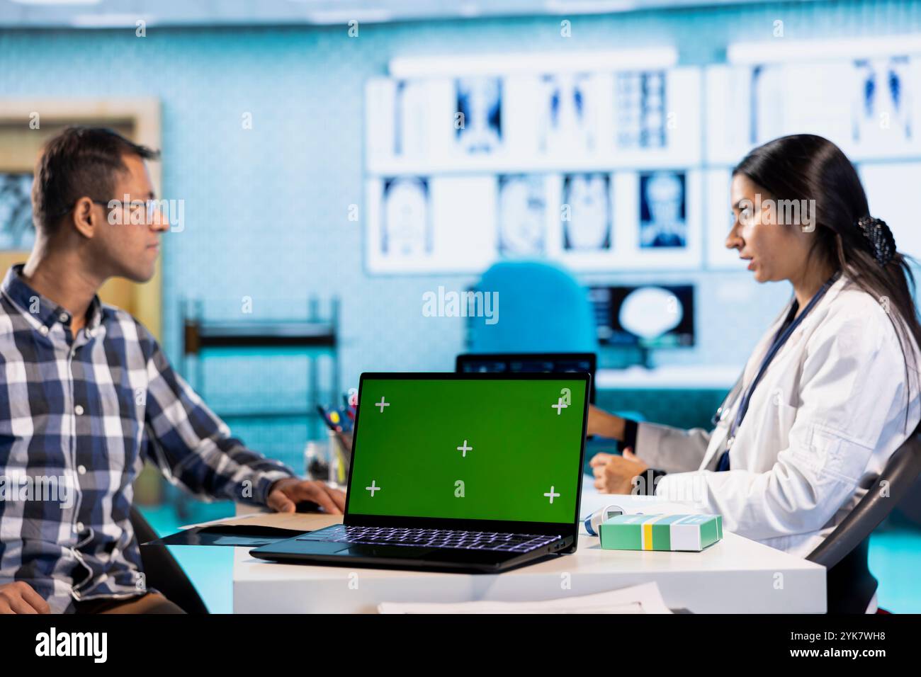 Specialist discussing x ray imaging with a patient next to isolated ...