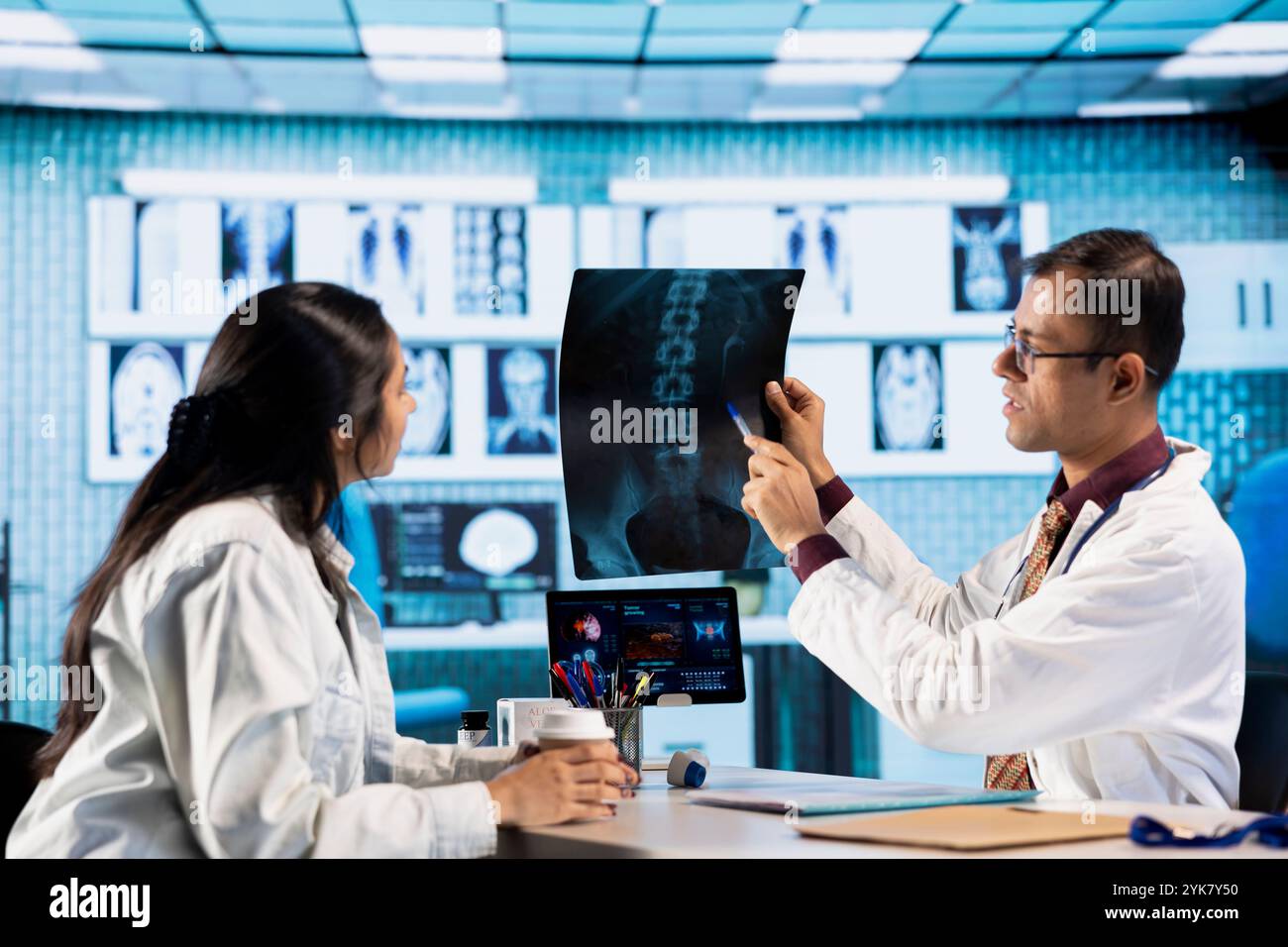 Indian expert explaining diagnostics through test results with a male ...