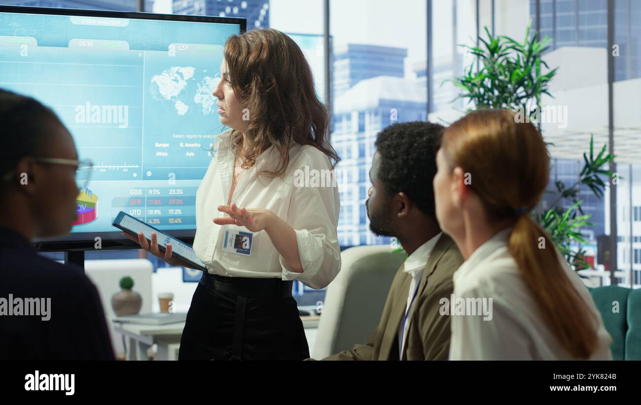 Organizational staff studying infographics on a tablet during ...