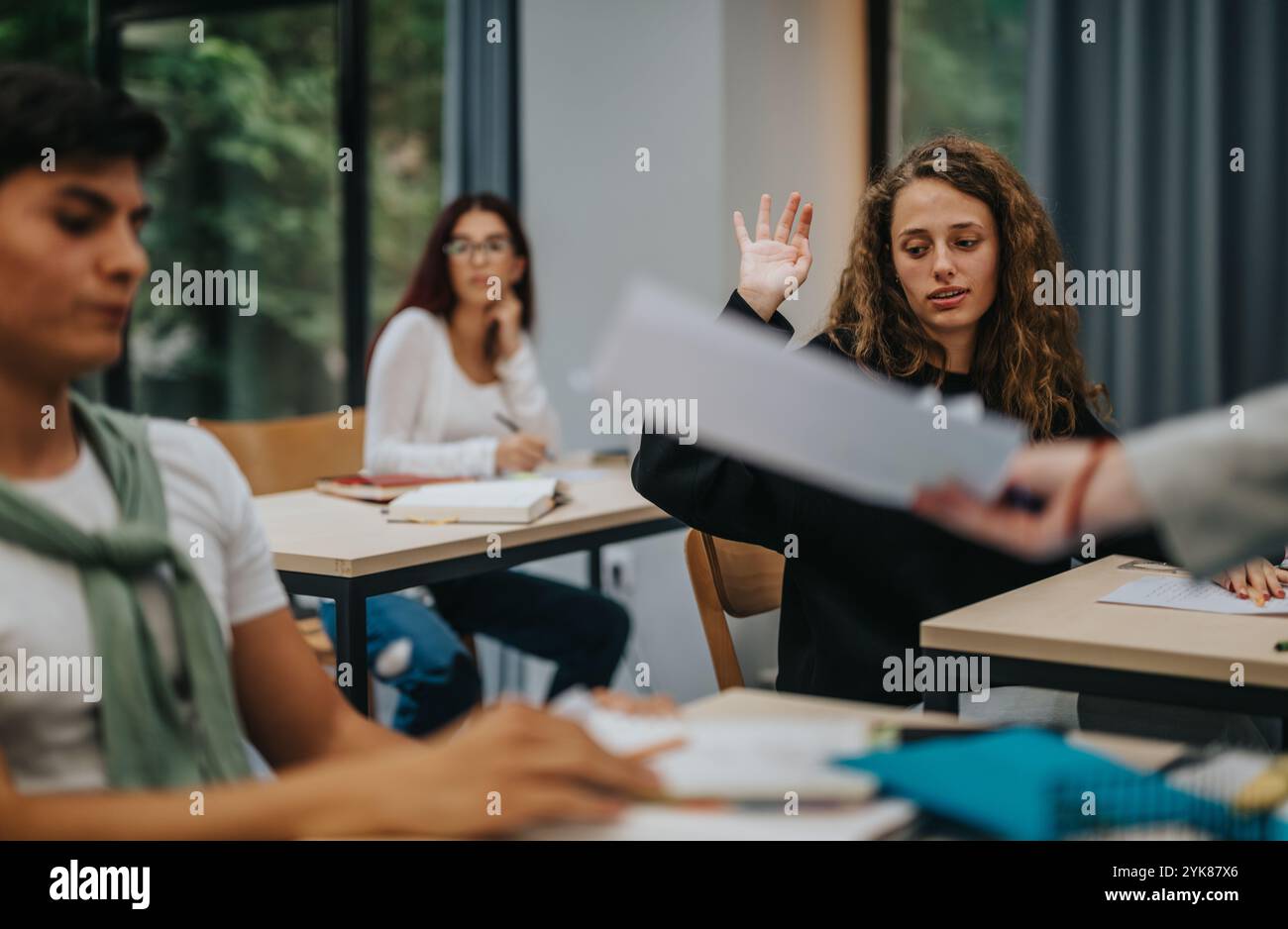 Students participating in a classroom lesson actively engaging with ...