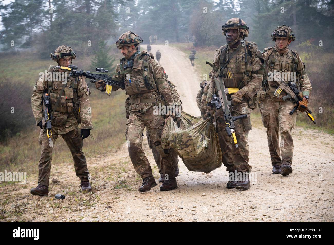 Cadets from the Royal Military Academy - Sandhurst carry a simulated ...