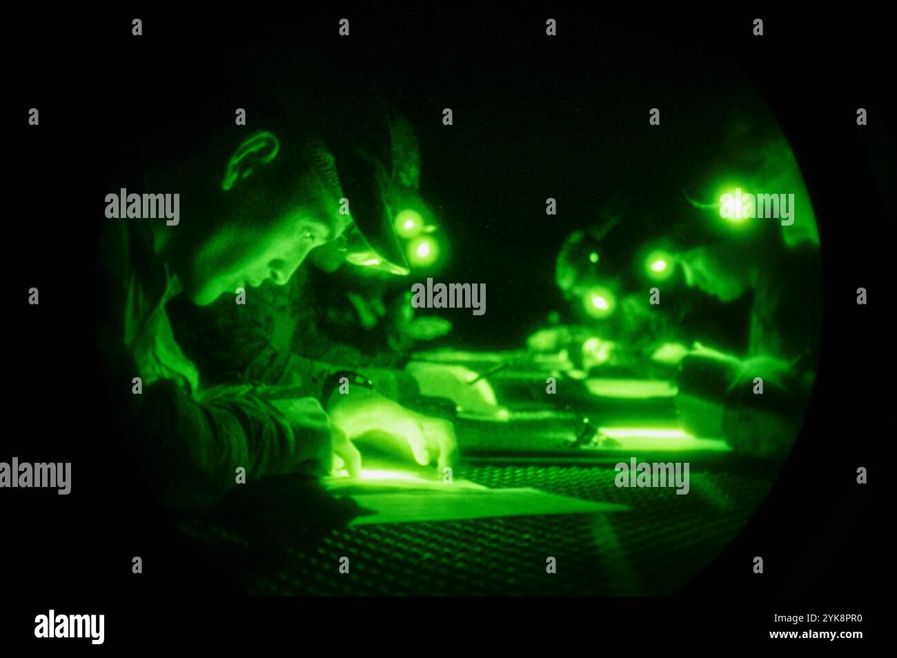 Utah National Guard Service Members plot their points on a grid while ...