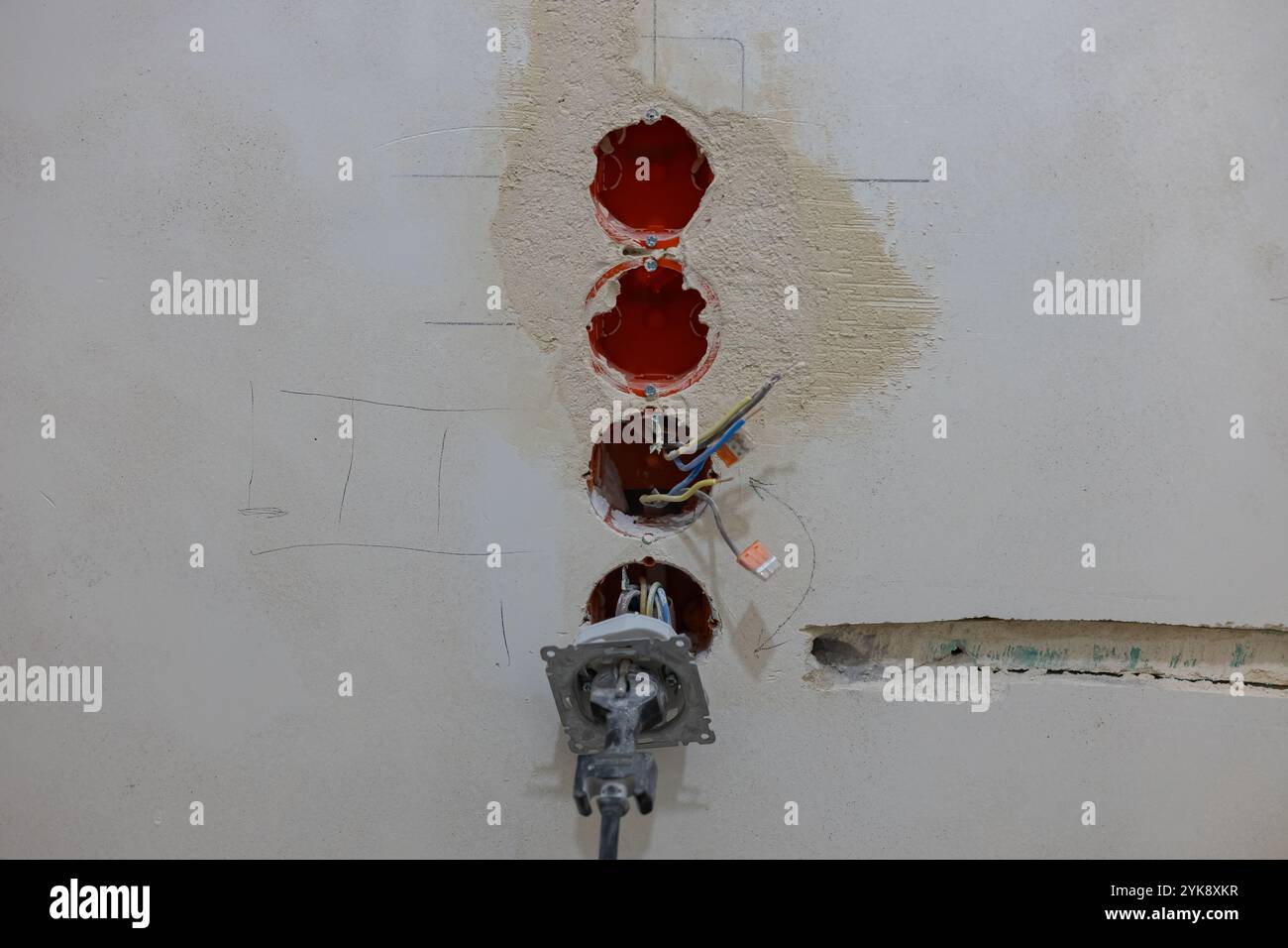 Electric wiring installation in progress with exposed wires, wall ...