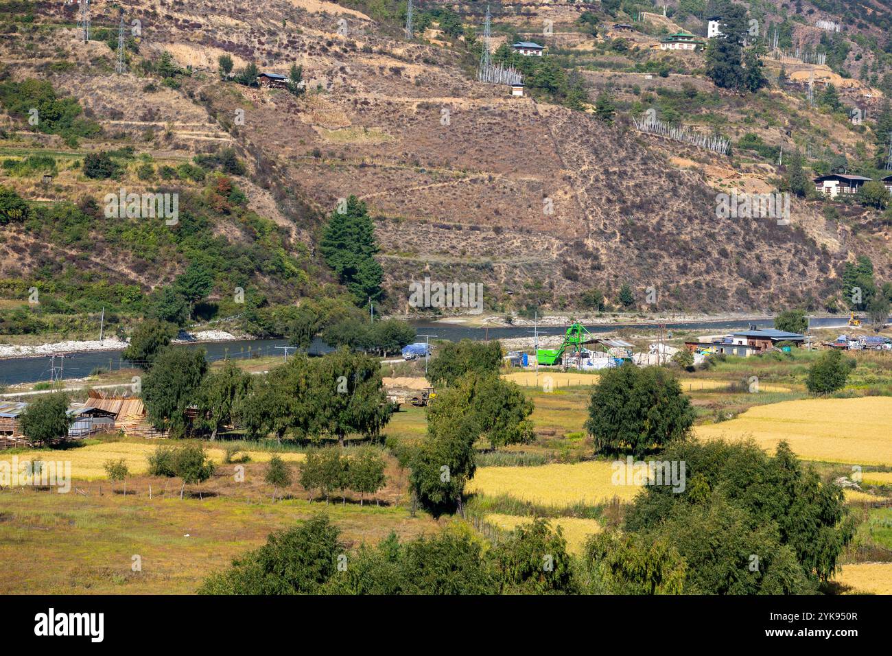 Typical village on the outskirts of Paro, Bhutan. Flatter land is often ...
