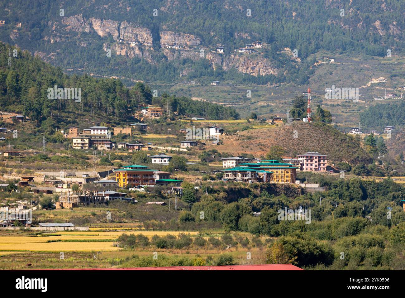 Typical village on the outskirts of Paro, Bhutan. Flatter land is often ...
