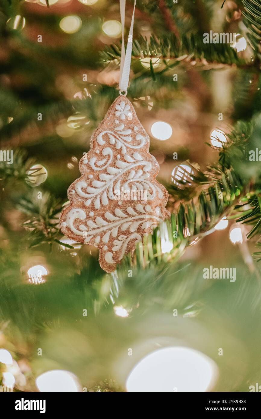 decorative gingerbread in the shape of a fir tree on fir branches with ...
