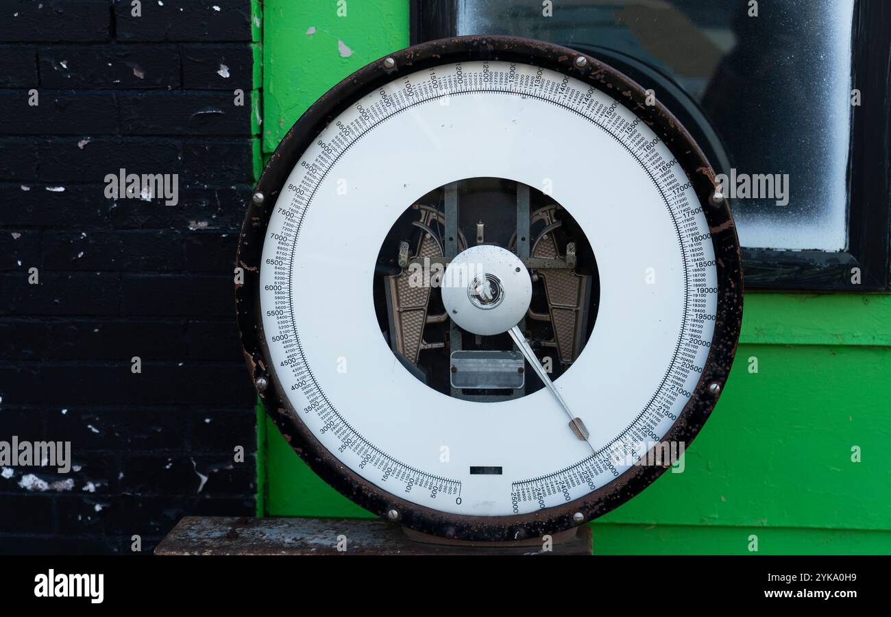 This is part of a large old vintage scale that is metal with green ...