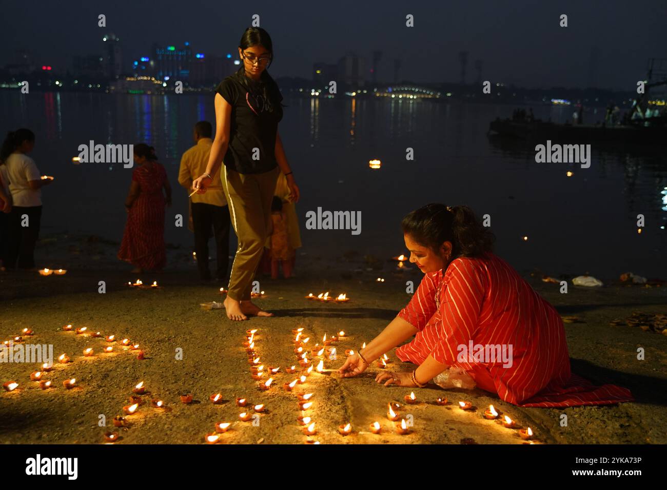 Kolkata, India, 15th November 2024: A river of light and devotion - Ganges aglow on Dev ...