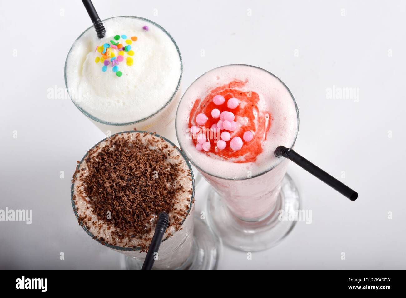 three types of milkshake drink on white background Stock Photo - Alamy