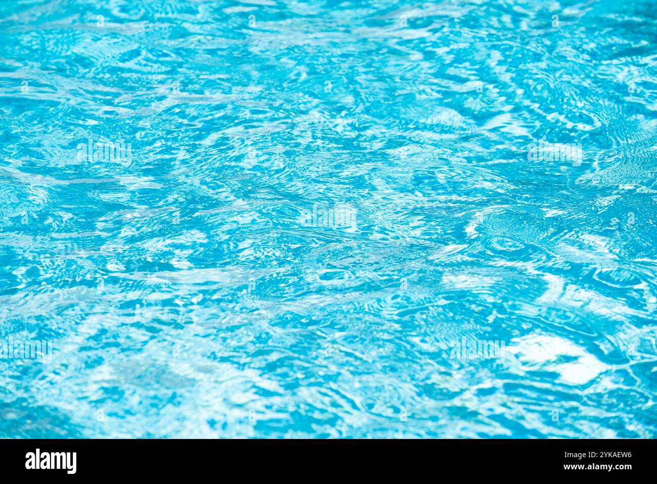 Ripple Water in swimming pool with sun reflection. Wavy water ...