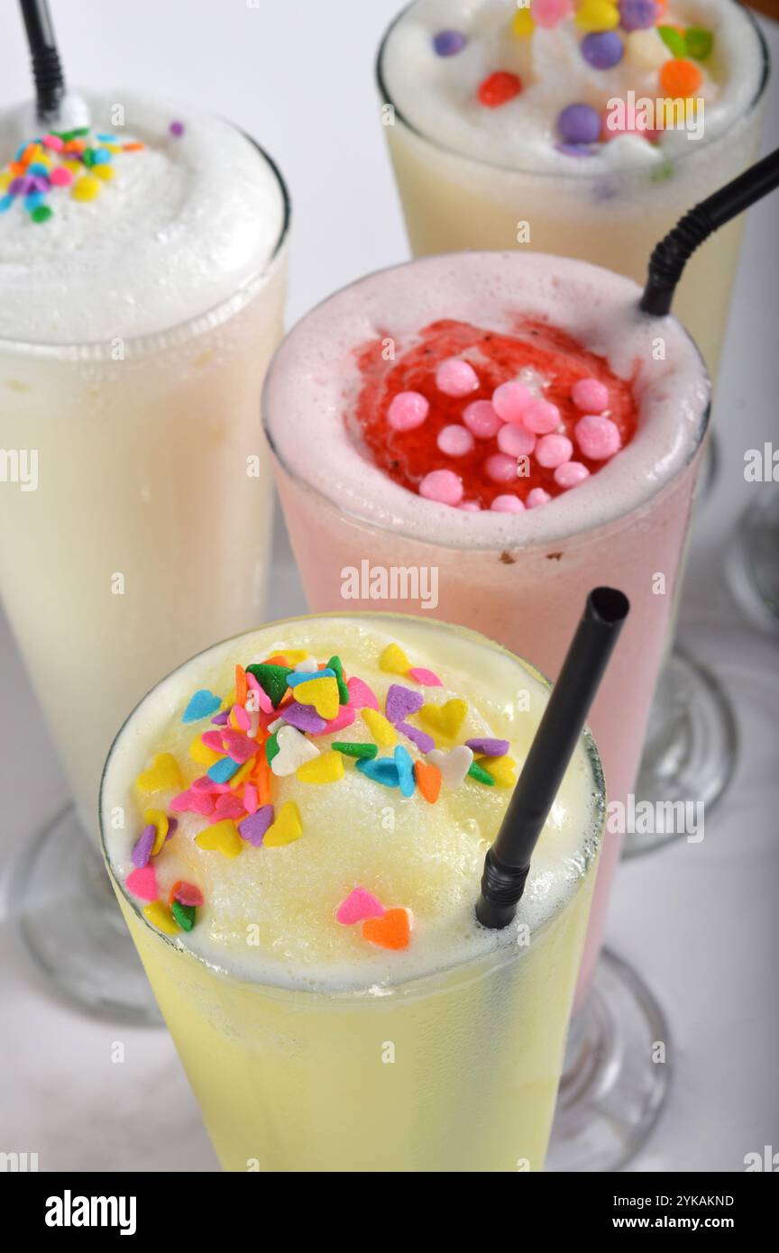four types of milkshake drink on white background Stock Photo - Alamy