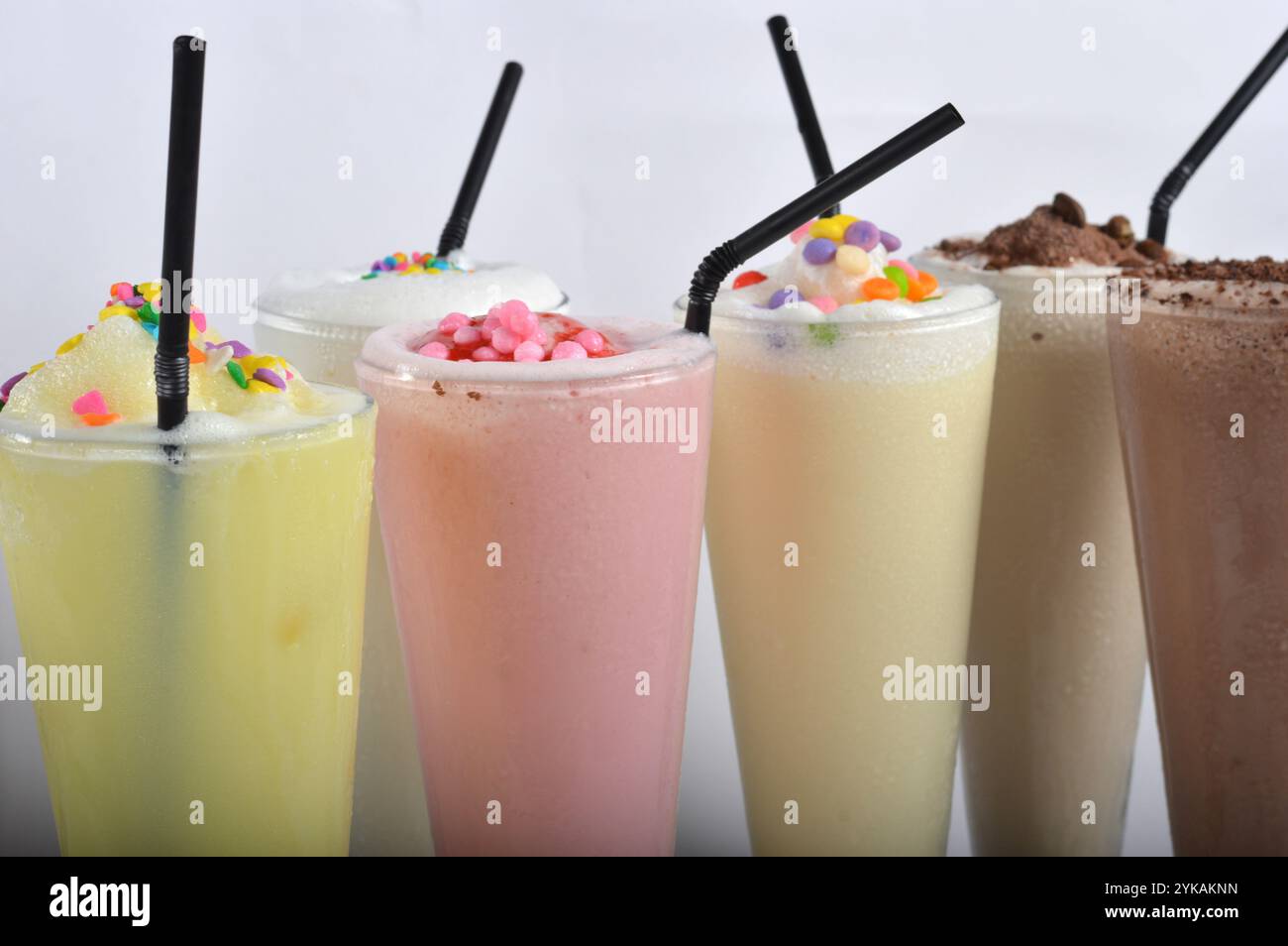 four types of milkshake drink on white background Stock Photo - Alamy