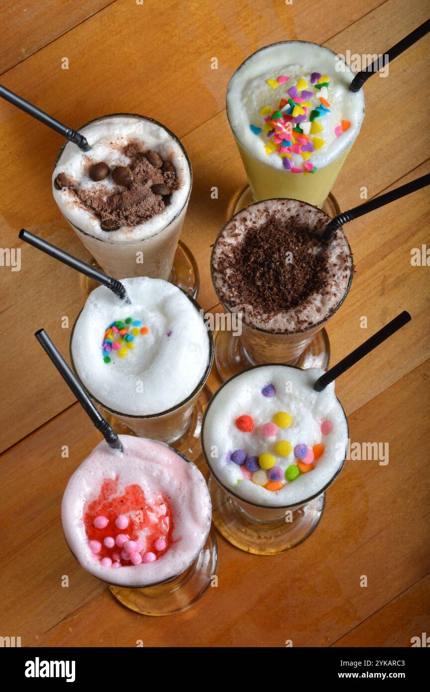 six types of milkshake drink on white background Stock Photo - Alamy